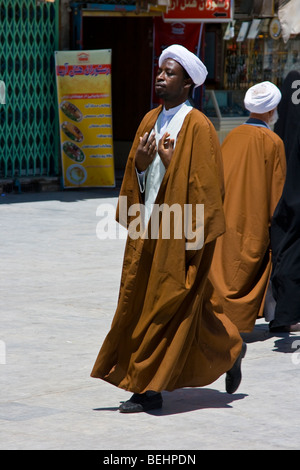 Iranian Shiite Mullah In Front Of An Old Caravanserai Turned Into ...