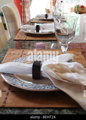 Place settings on kitchen counter Stock Photo - Alamy