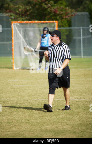 REFEREE KEEPING AN EYE ON THE ACTION HIGH SCHOOL GIRLS LACROSSE RICHARD ...