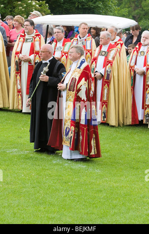 Dean of St Albans Very Revd Dr Jeffrey John holds aloft model of head ...