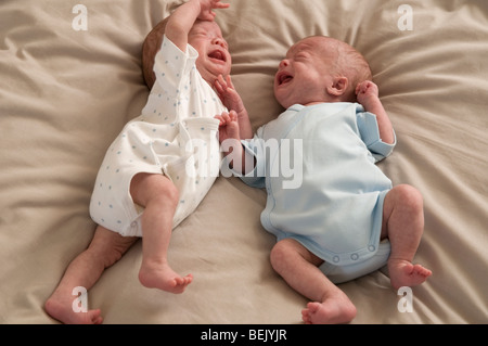 Premature babies crying, identical twin boys Stock Photo - Alamy