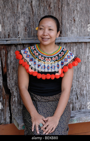 Portrait of a Smiling Woman of the Iban Tribe Wearing a Traditional ...