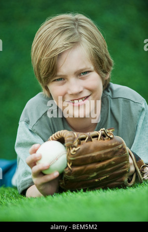 a young boy posing with a baseball mitt Stock Photo - Alamy