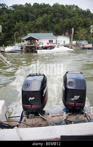 boat with outboard engine leaving the dock Stock Photo - Alamy