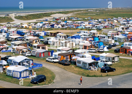 Caravans and camping tents at busy campsite in the dunes along the ...