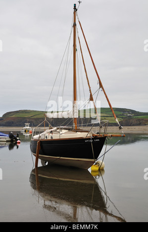Yacht on beaching legs at low tide, Newport, Pembrokeshire, Wales Stock ...