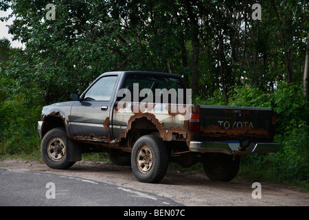 Old rusty junky Toyota pickup truck nobody in USA US horizontal hi-res ...