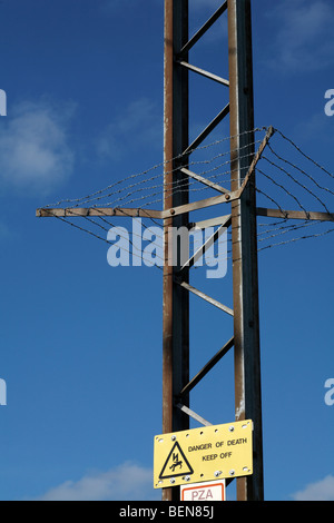 Electricity pylon with warning notice (in German Stock Photo - Alamy