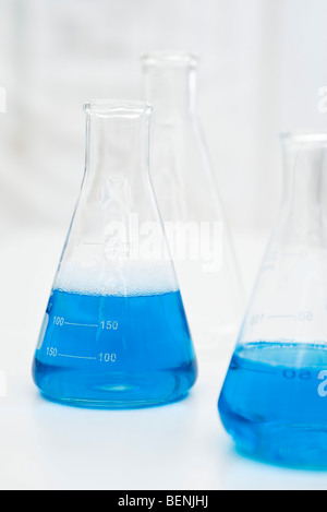Erlenmeyer flasks containing color liquid decorated with boiling flask ...