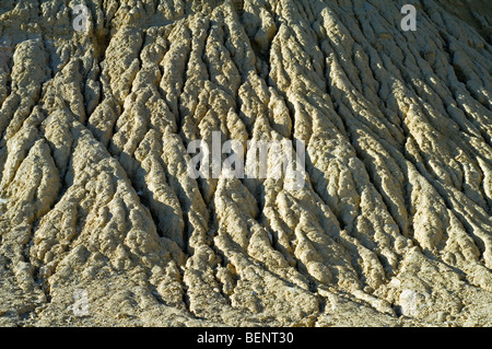 Gullies in soft rock of cliff caused by rain water erosion Stock Photo ...