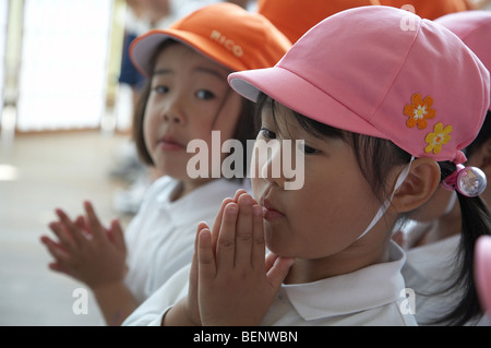 JAPAN Kindergarten children praying and visiting Catholic Chapel at ...
