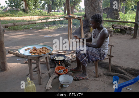 SOUTH SUDAN Woman making cakes, her small business, Yei. PHOTO by SEAN ...