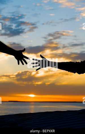 Hand reaching out or pulling away Stock Photo - Alamy
