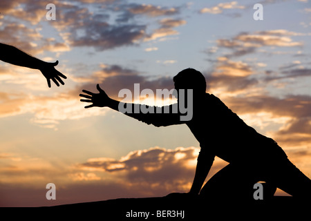 Hand reaching out or pulling away Stock Photo - Alamy