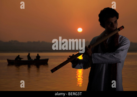 Silhouette man playing flute Stock Photo - Alamy