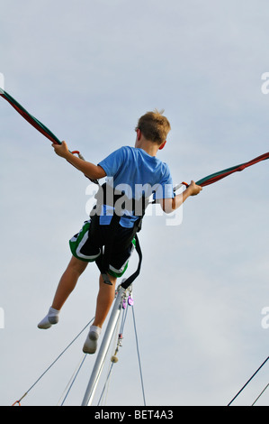 Boy enjoying European bungee Stock Photo - Alamy