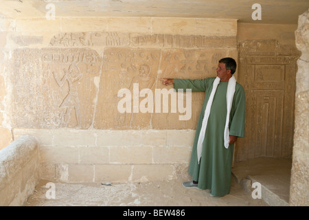 Guide shows Inscription at Mastaba near Saqqara Step Pyramid of Pharaoh ...