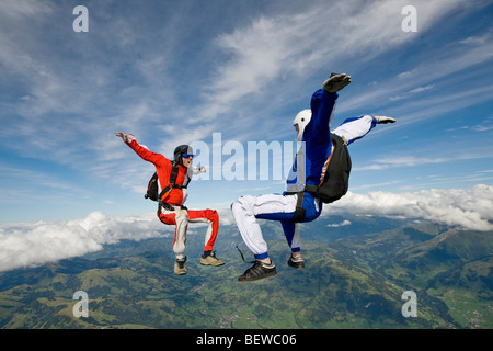 two people doing parachute jumping, full shot Stock Photo - Alamy