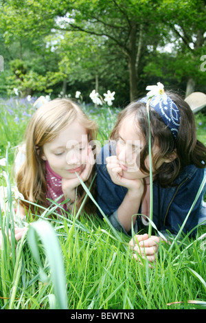 Kids sharing secrets as talking Stock Photo - Alamy
