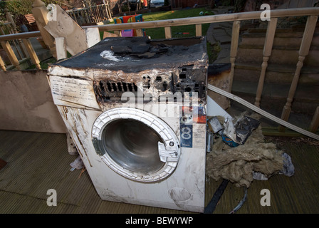 Burnt washing machine accidental fire Stock Photo - Alamy