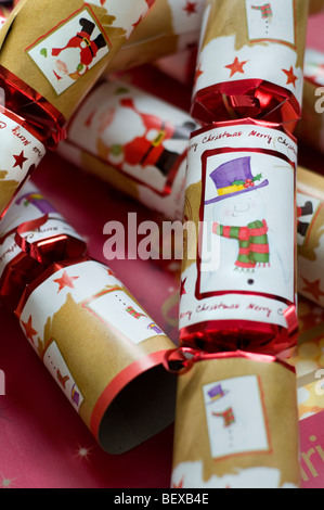 Closeup of many red Christmas crackers in a row Stock Photo - Alamy