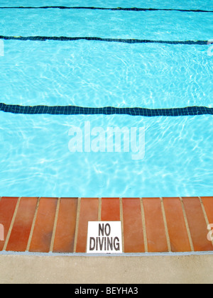Shallow swimming pool with no diving allowed Stock Photo - Alamy
