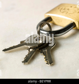 Padlock with three keys Stock Photo - Alamy