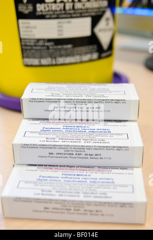 doctor with gloves while administering the vaccine on the arm of the ...