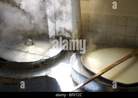 Albania, Benca steaming vats in a small cottage industry cheese factory ...