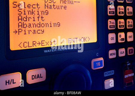 Making an emergency distress call on VHF DSC marine radio Stock Photo ...