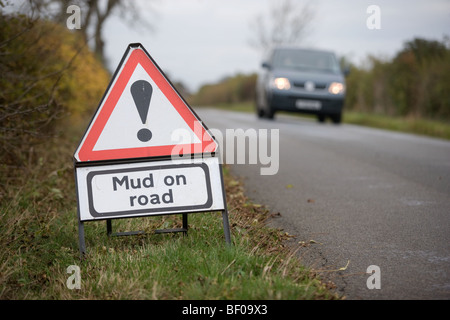 Mud On Road Sign Stock Photo - Alamy