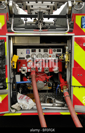 Fire engine rear pump locker with hose attached Stock Photo - Alamy