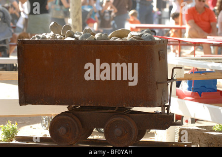 Mining cart filled with rocks in a old abandoned mine tunnel Stock ...