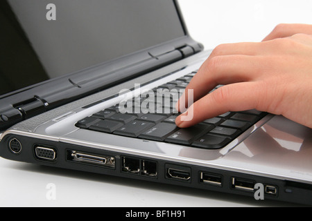 Hand typing on notebook keyboard Stock Photo - Alamy