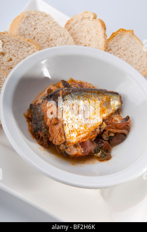 Vertical high angle shot of meat and vegetables in a black pot on a ...