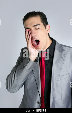 Businessman yawn boring on gray background with suit and red tie Stock ...