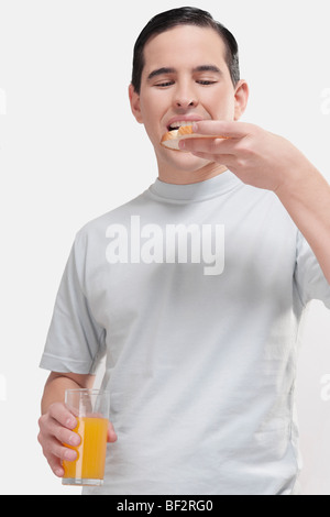 Close-up man biting toast Stock Photo - Alamy
