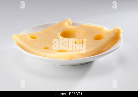 Slice of emmenthal cheese Stock Photo - Alamy