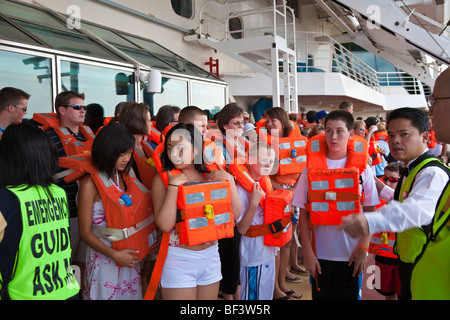 Muster drill with passengers on a cruise ship Stock Photo - Alamy