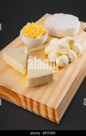 High angle shot of assorted delicious doughnuts on a wooden table Stock ...