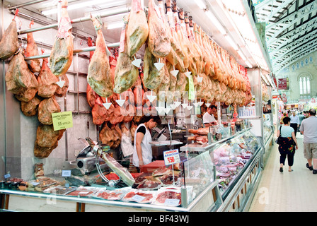 Hams hang in butcher shop in Madrid Spain Stock Photo - Alamy