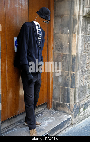 Street performer dressed as invisible man standing and giving a thumbs ...
