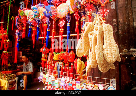 Local souvenir store selling straw hats and Chinese ornaments, Ciqikou ...