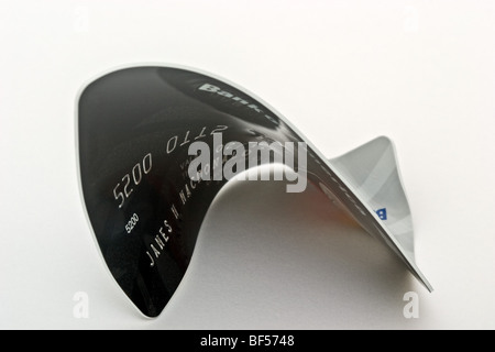 Melted twisted credit card Stock Photo - Alamy