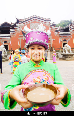 Tujia women in traditional costume sewing, Taiyanghexiang County, Enshi ...