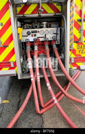 Fire engine rear pump locker with hose attached Stock Photo - Alamy