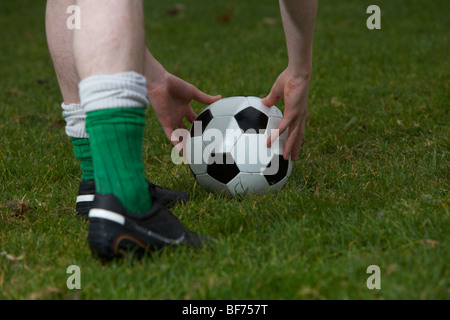 soccer football player placing the ball down for a kick Stock Photo - Alamy
