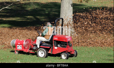 A Toro groundsmaster 328-D fitted with a front power leaf blower ...
