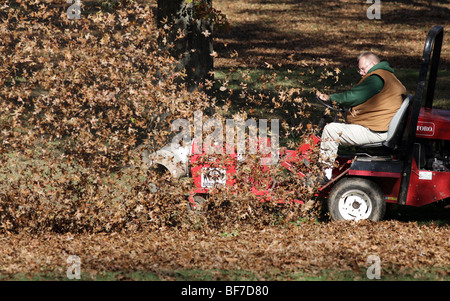 A Toro groundsmaster 328-D fitted with a front power leaf blower ...