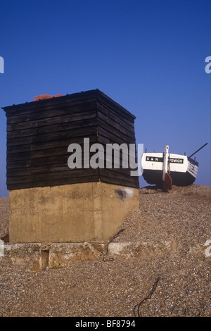 Dunwich Suffolk UK Steep shingle beach with fishing boat black ...